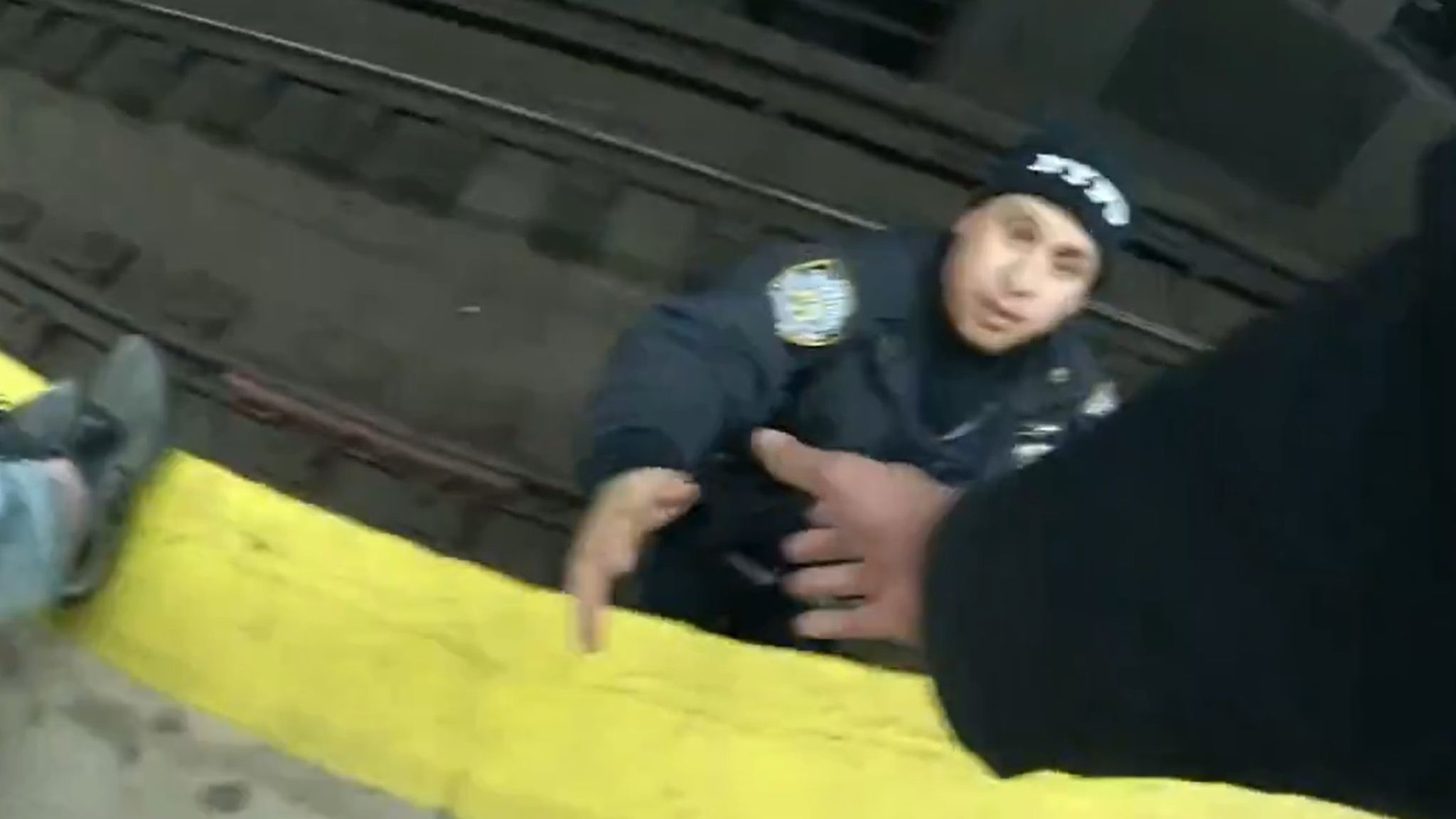 NYPD officer jumps on to subway tracks to rescue man | US News | Sky News