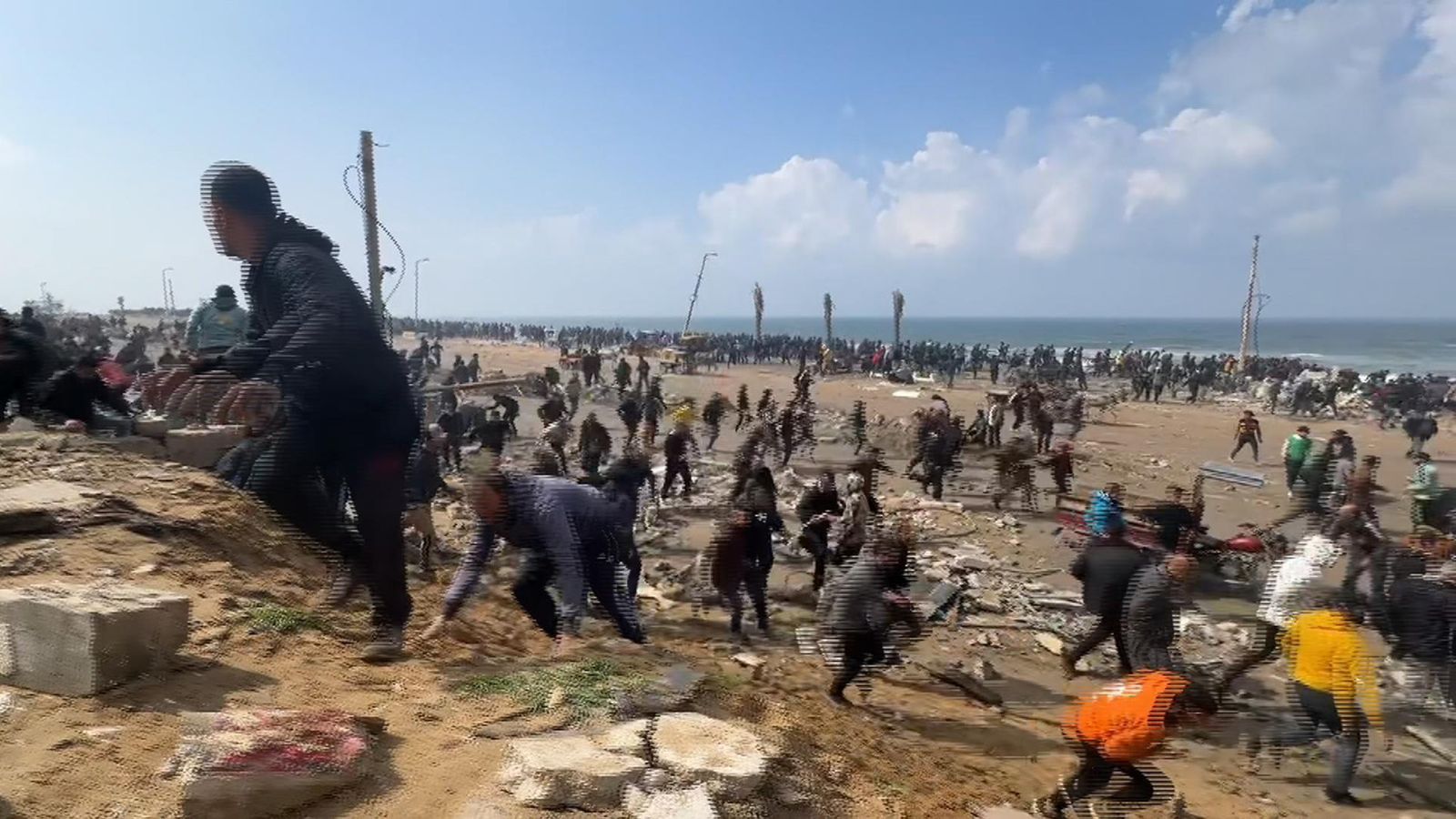 People flee gunfire on Gaza City beach as people collect aid | World ...