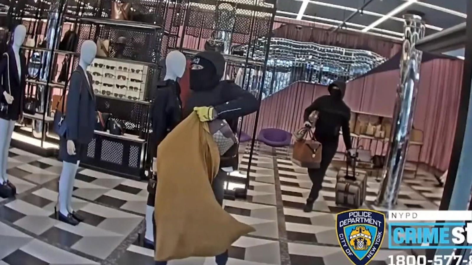 New York: Moment armed robbers ransack Gucci store | US News | Sky News