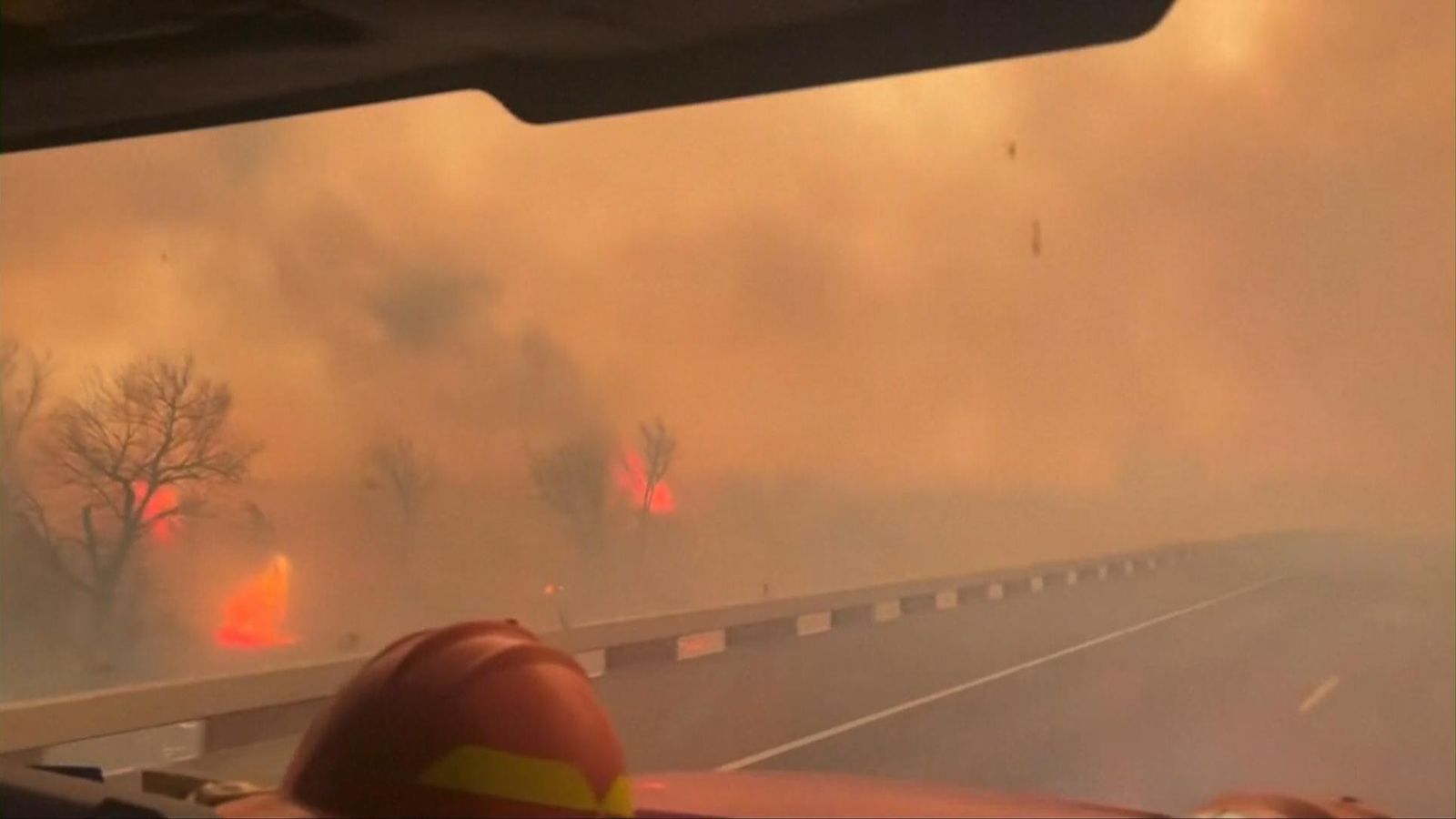 Texas wildfire: Watch as fire truck drives through wall of flames | US ...