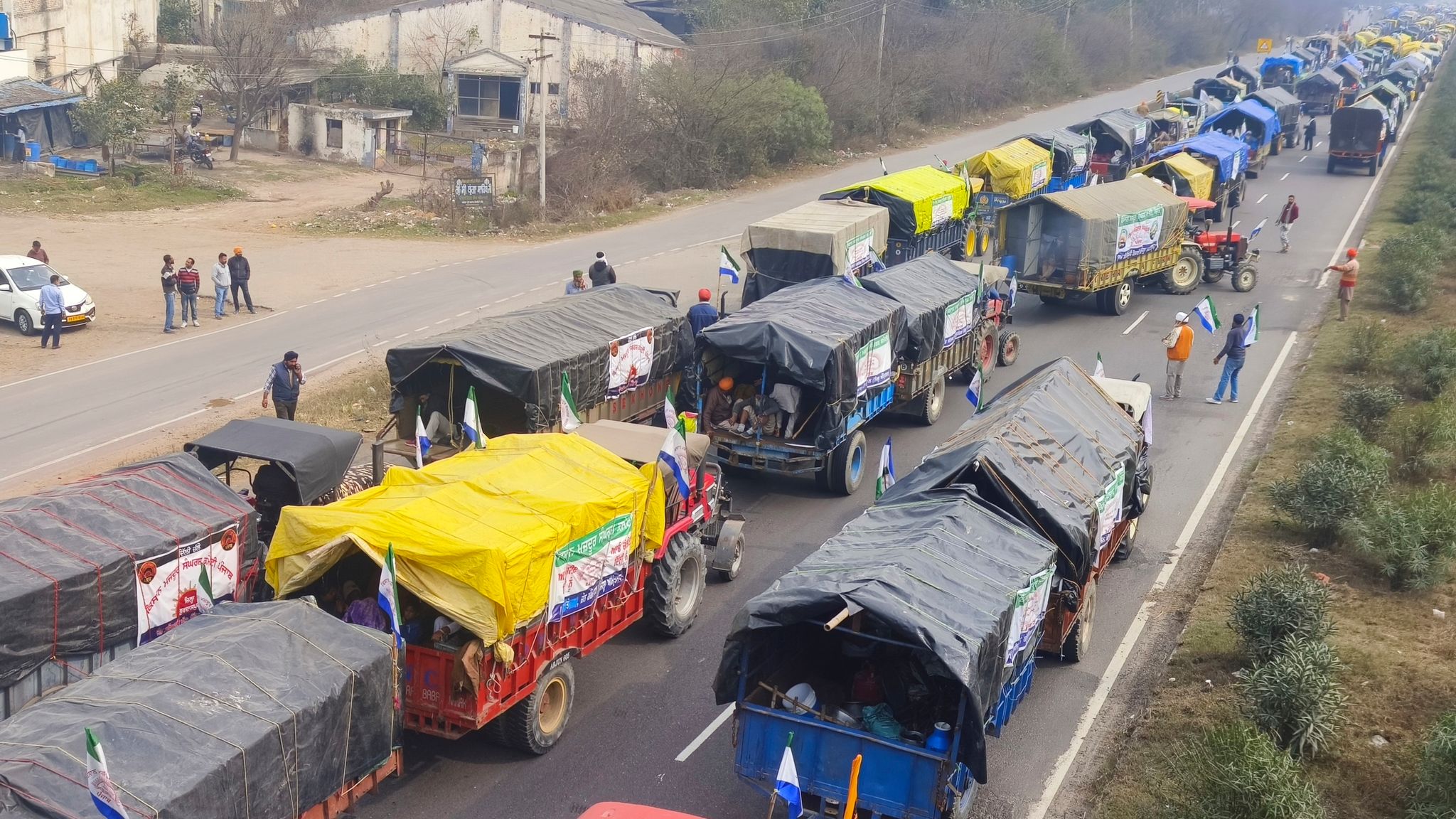 India: Tear gas dropped from drones as protesting farmers march towards ...