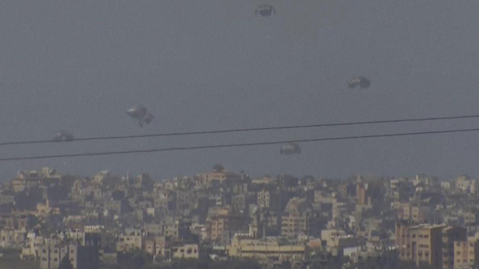 Israel-Hamas war: Humanitarian aid is seen being parachuted into Gaza ...