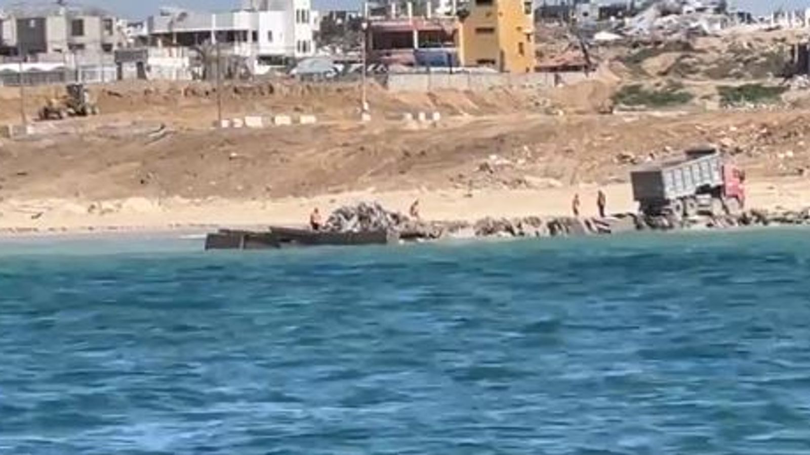 Middle East latest: First load of aid shipped from Cyprus taken ashore ...