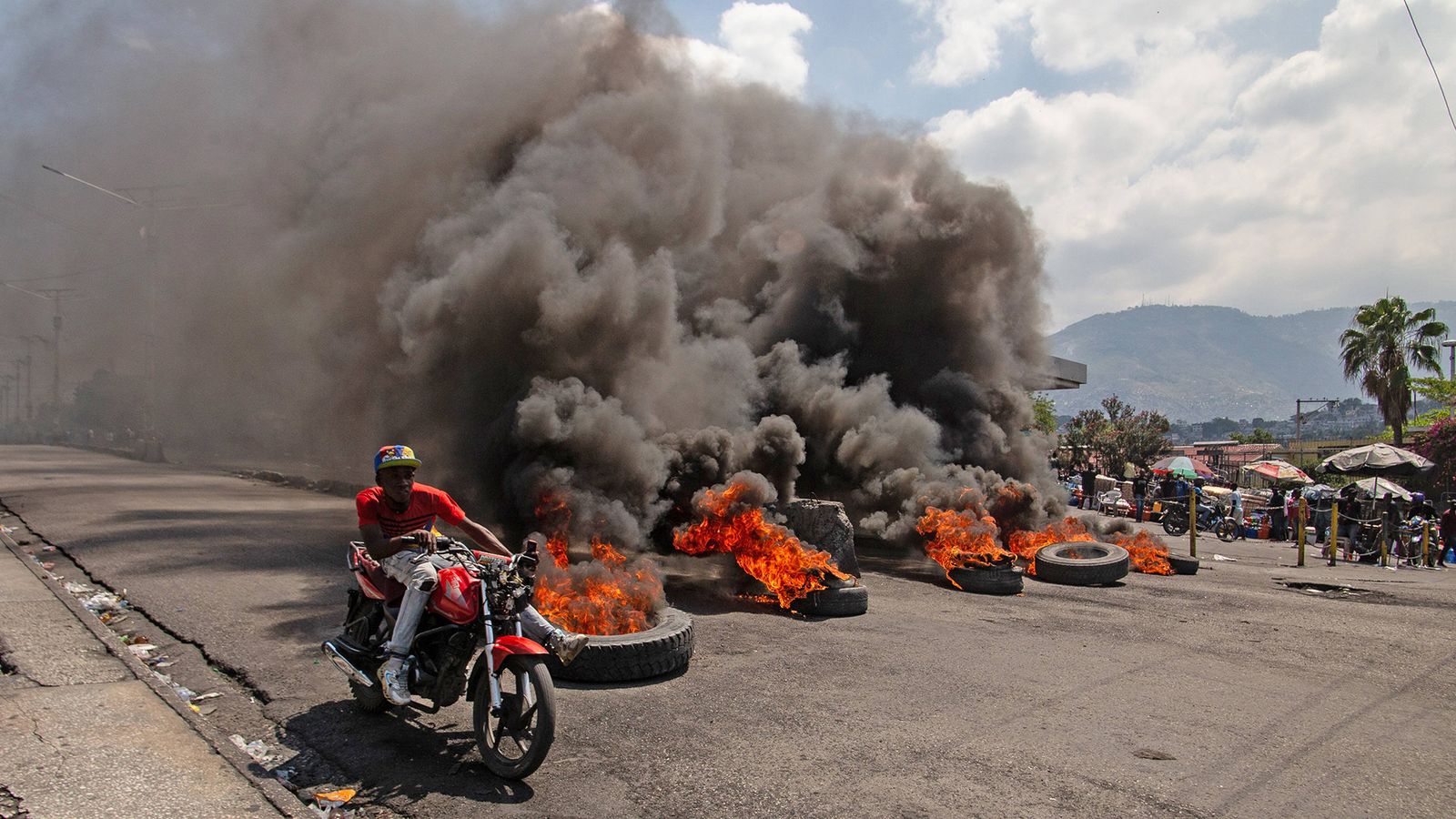 Haiti gang violence: 12 bodies seen in streets as gangs attack upmarket ...