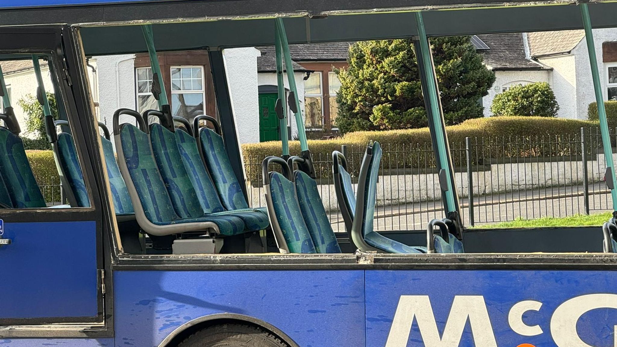Five people taken to hospital after bus crashes into block of flats in ...