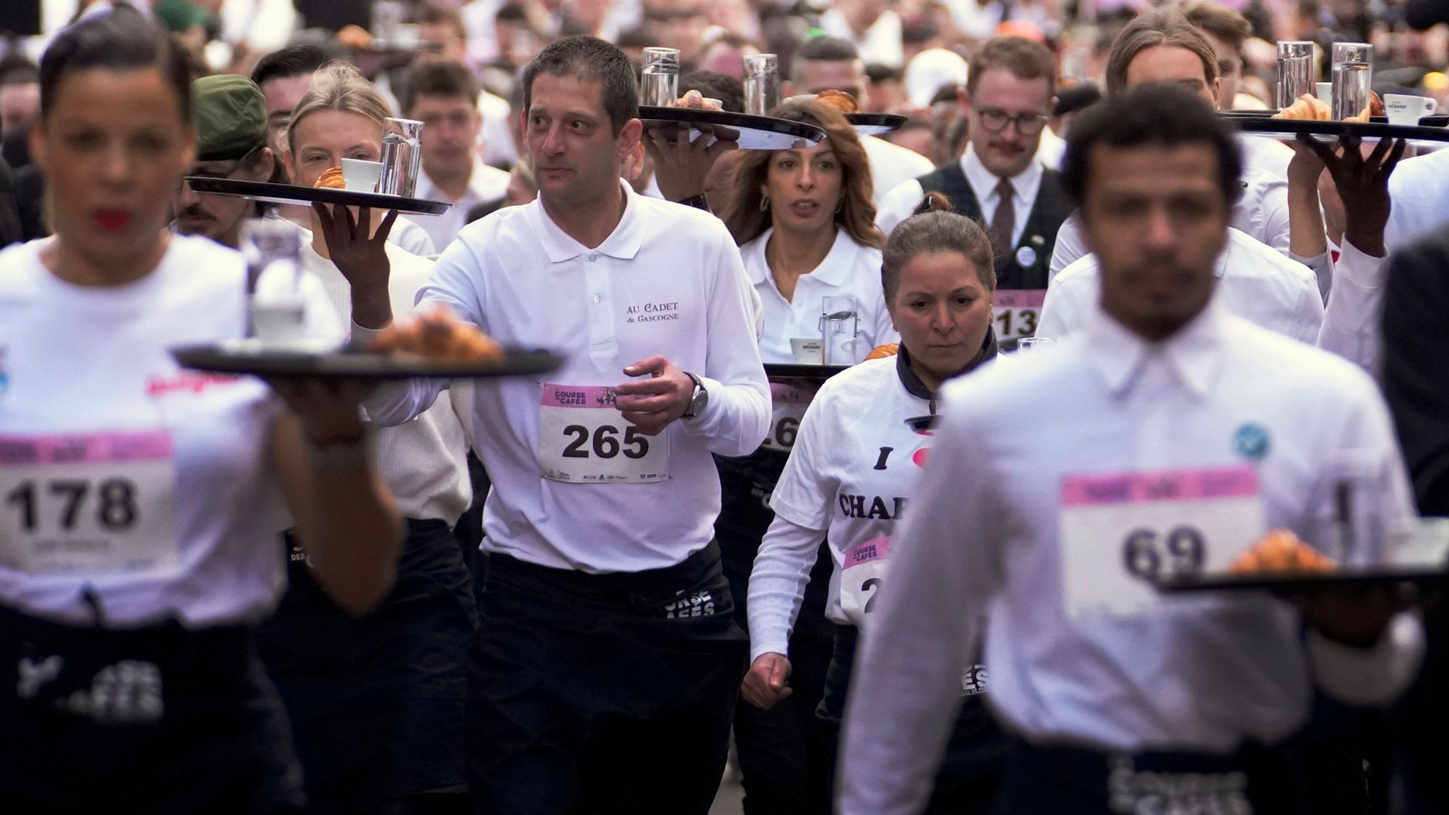 Waiters and waitresses race through streets of Paris for first time in ...