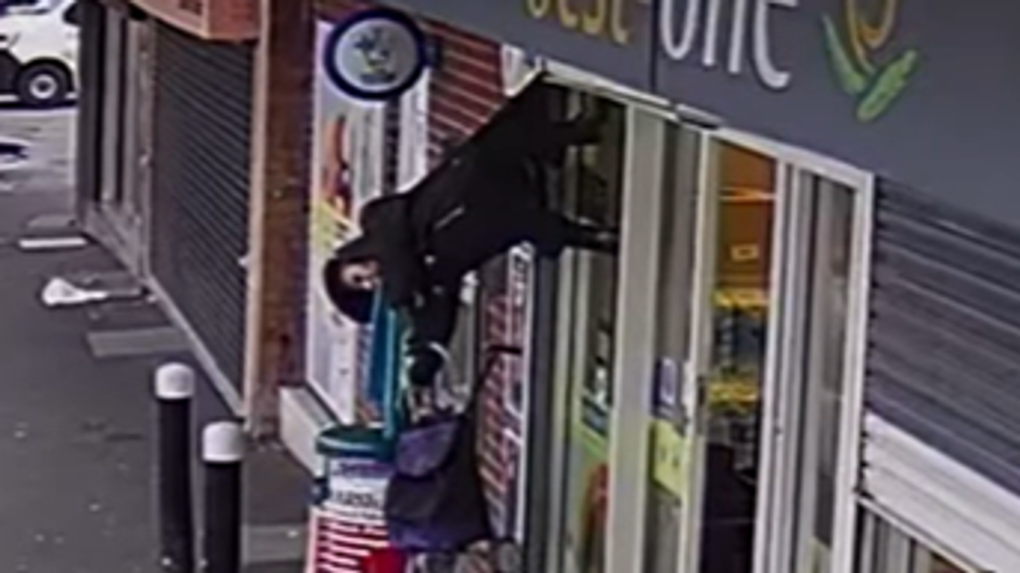 Viral video of grandmother caught in shop shutters immortalised in ...