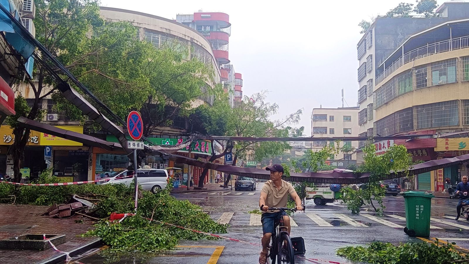 China floods: Four dead as cities submerged after days of record ...