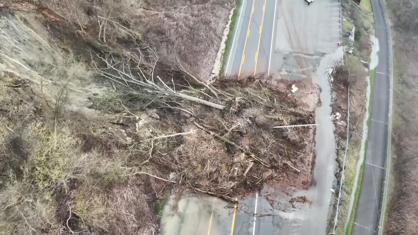 US: A landslide has damaged a nearby cemetery and blocked off a road in ...