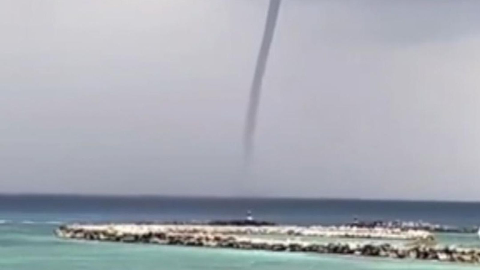 Mexico: Waterspout forms near shoreline | World News | Sky News