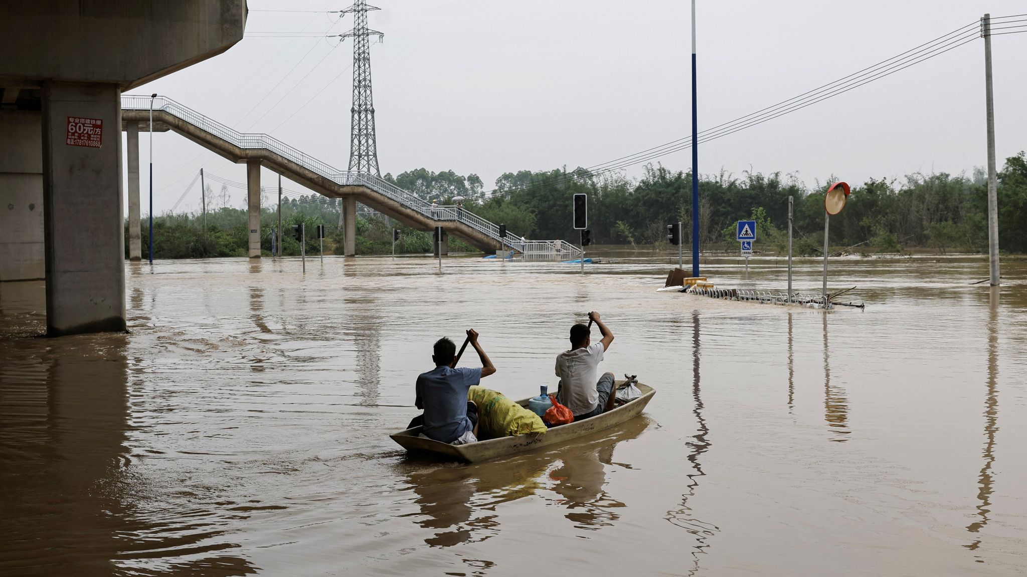 China floods: Four dead as cities submerged after days of record ...
