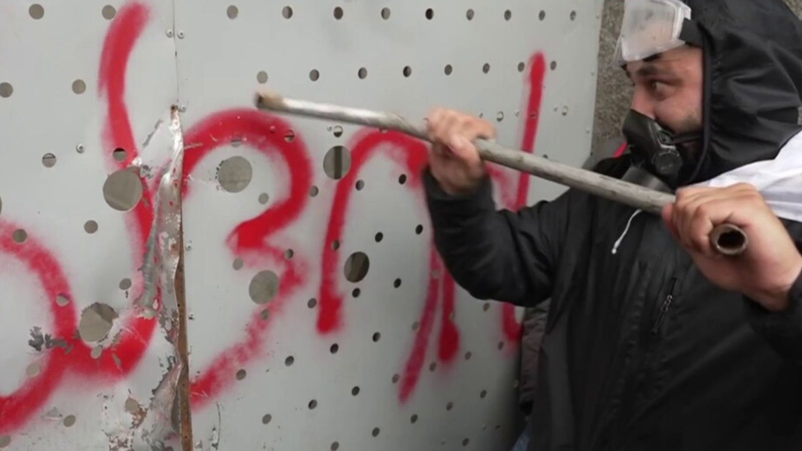 Angry demonstrators with crowbars attempt to break into Georgian ...