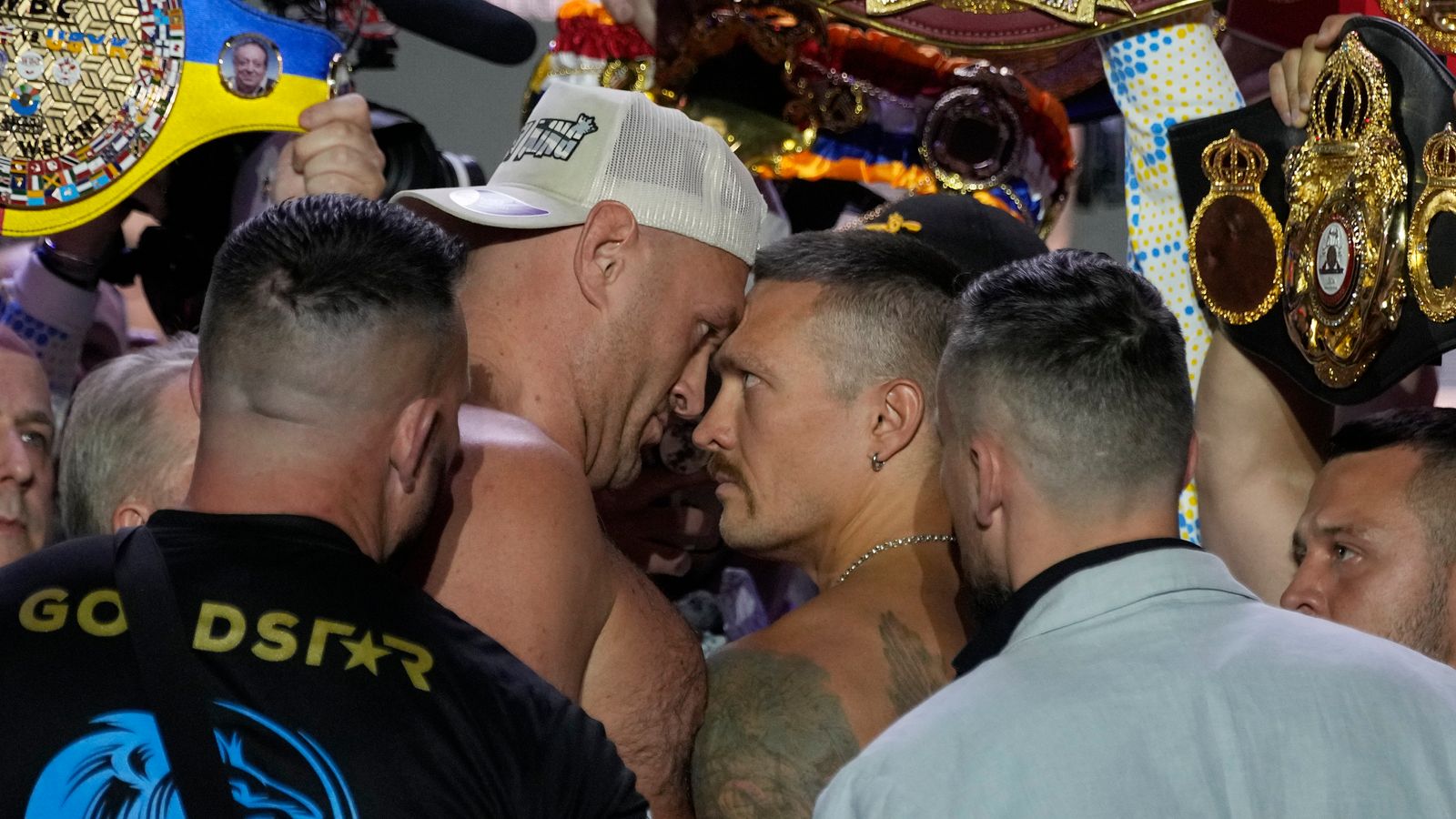 Tyson Fury shoves Oleksandr Usyk in weigh-in clash | World News | Sky News