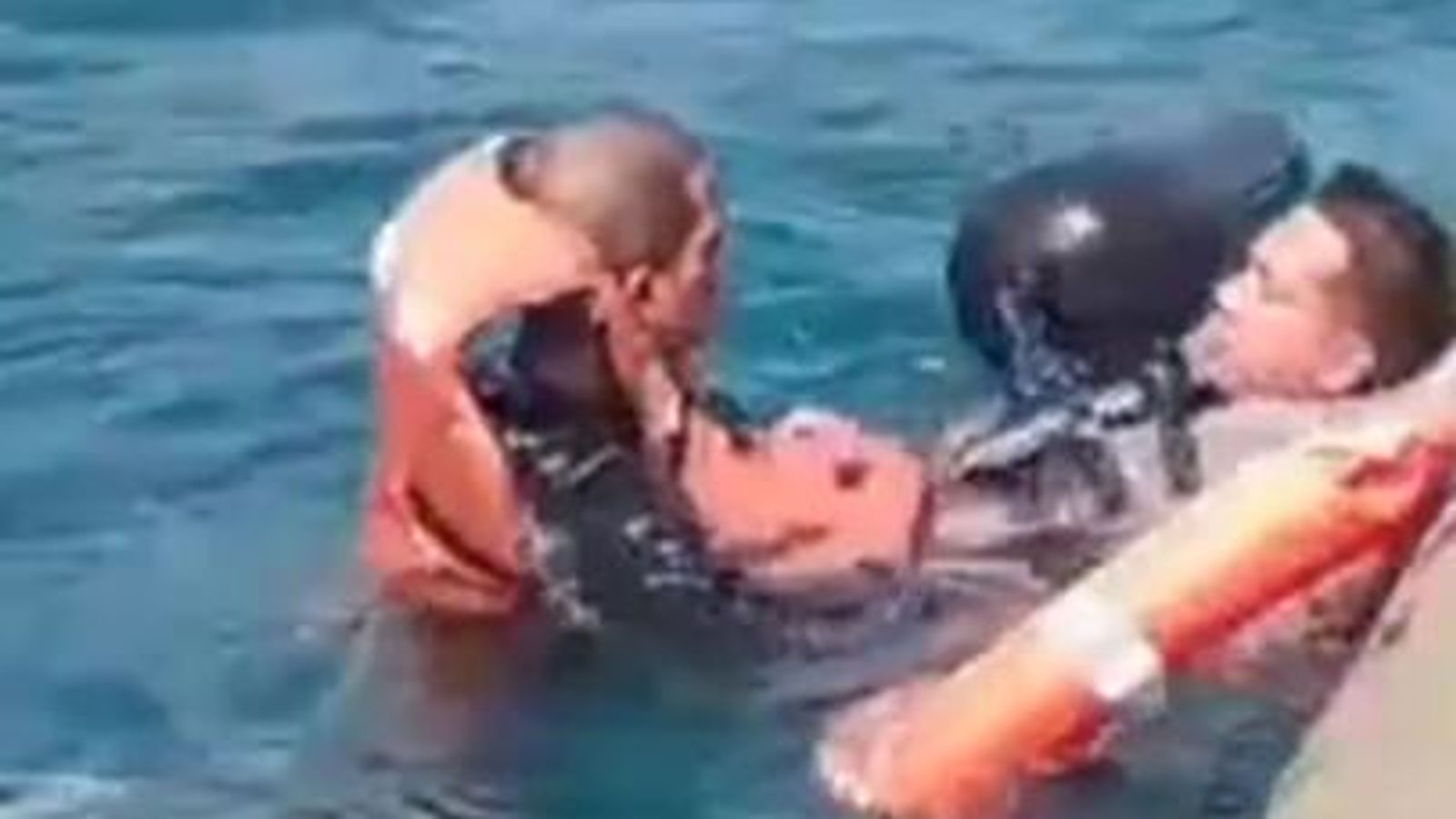 Moment four people are rescued from sinking boat | World News | Sky News