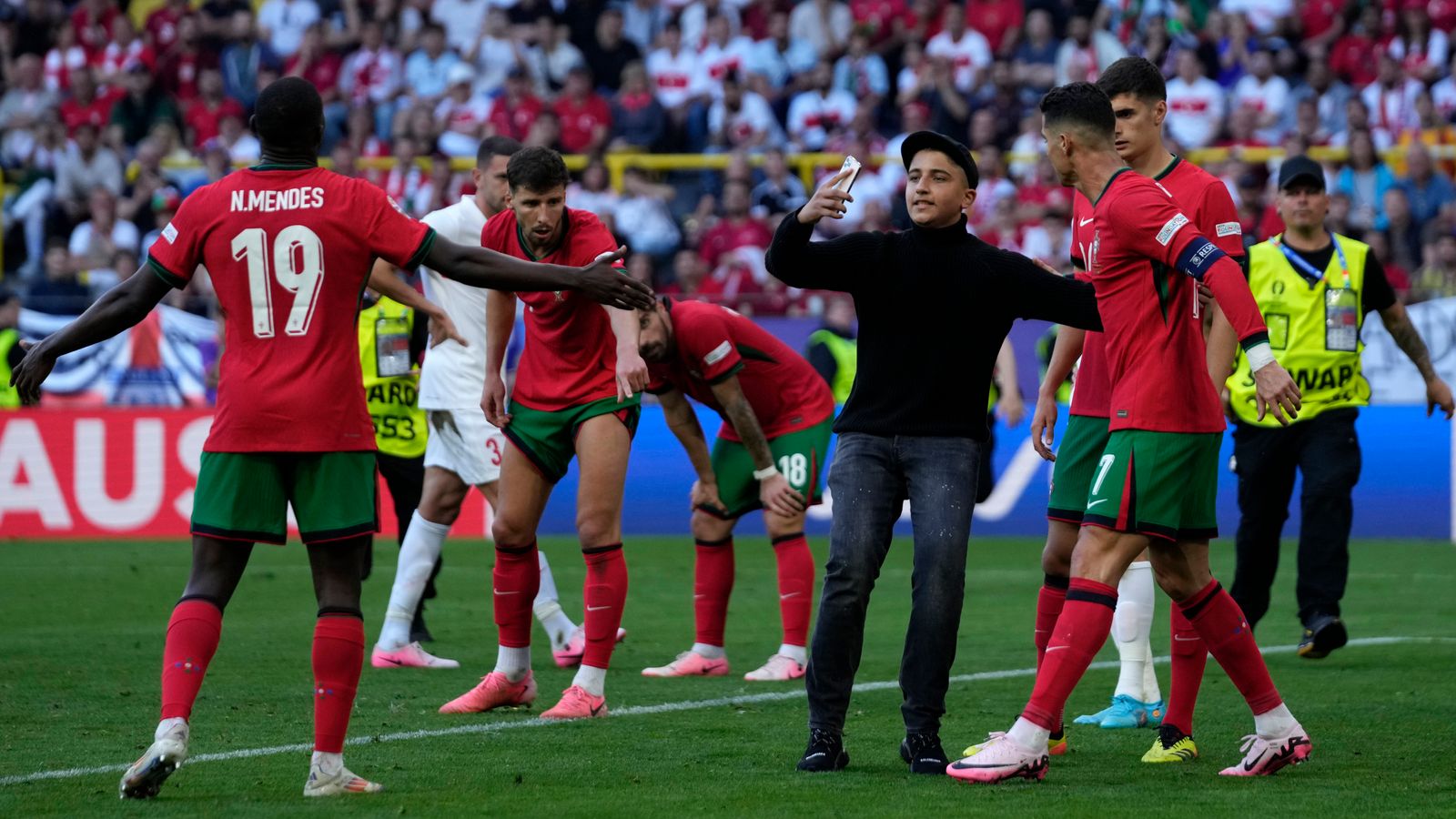 Pitch invaders keen for Cristiano Ronaldo selfies disrupt Turkey v ...
