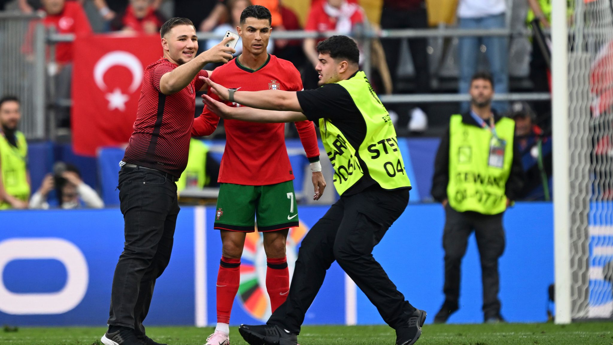 Pitch invaders keen for Cristiano Ronaldo selfies disrupt Turkey v ...