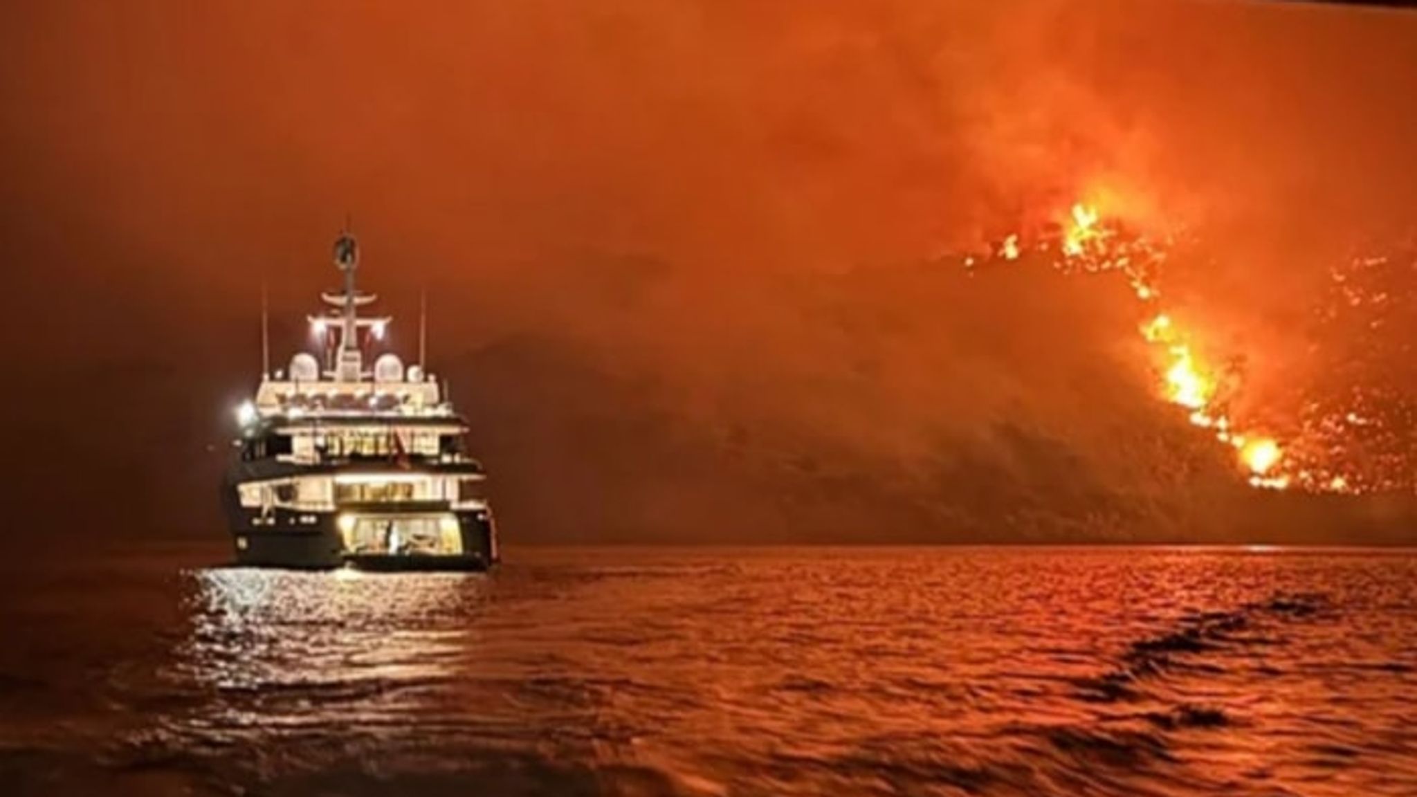 'Yacht fireworks' spark forest blaze in Greece | World News | Sky News