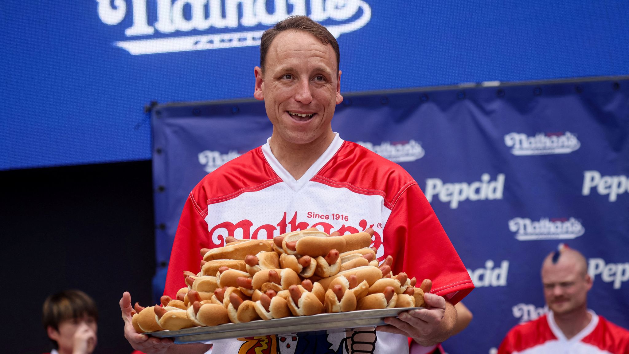 Joey Chestnut, 16-time hot dog eating champion, banned from event for ...