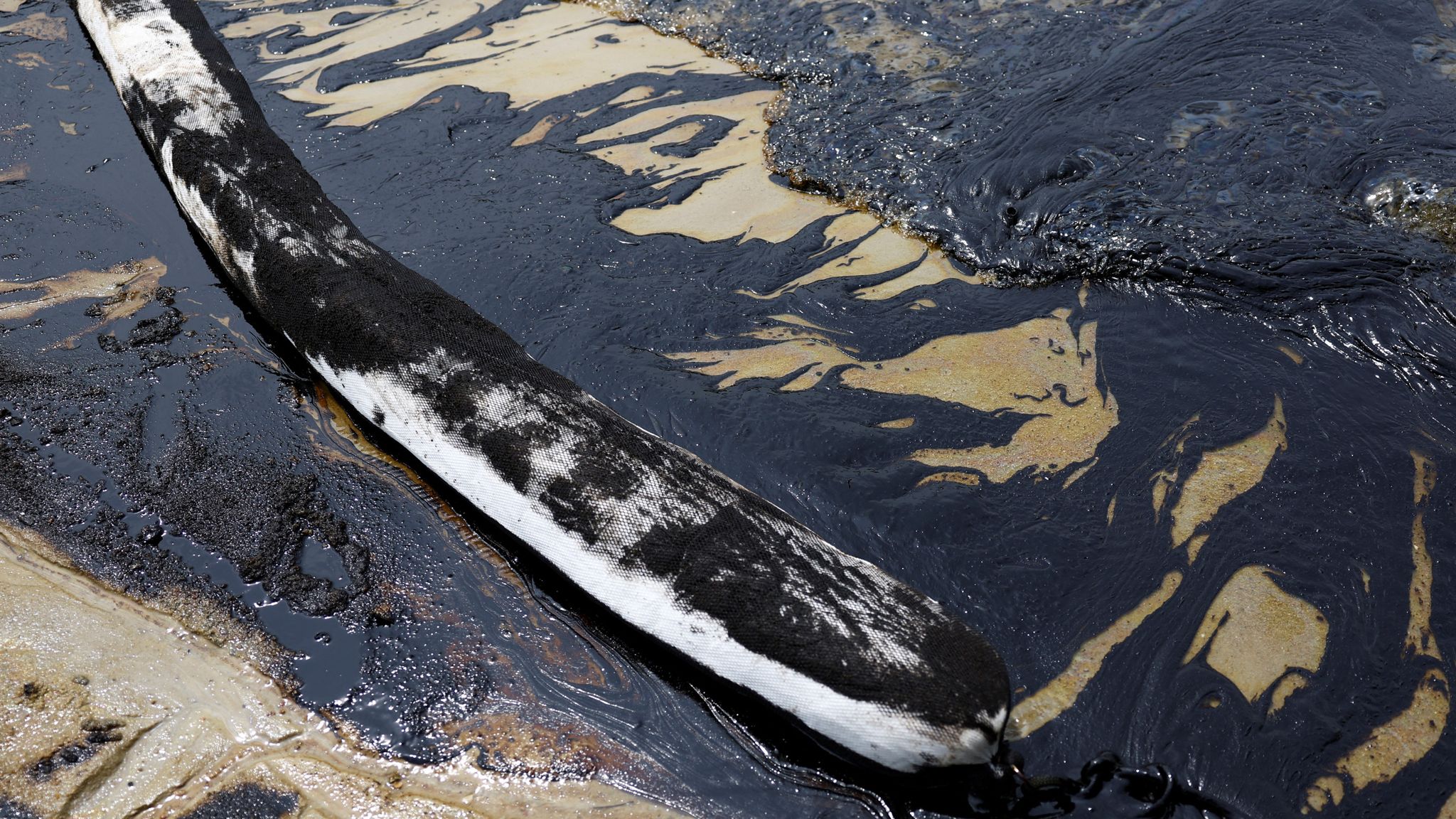 Singapore says boat 'lost control' and hit tanker causing oil spill ...