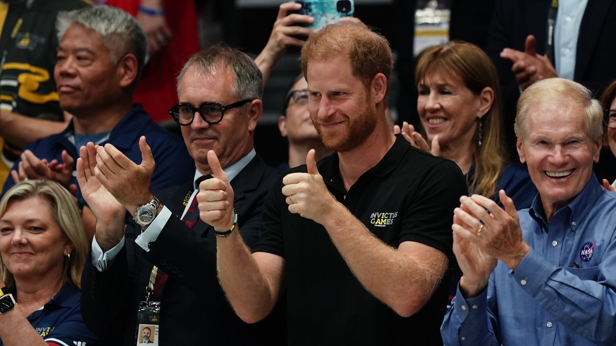 Prince Harry and Meghan cheer as Team UK walks on to Invictus Games ...