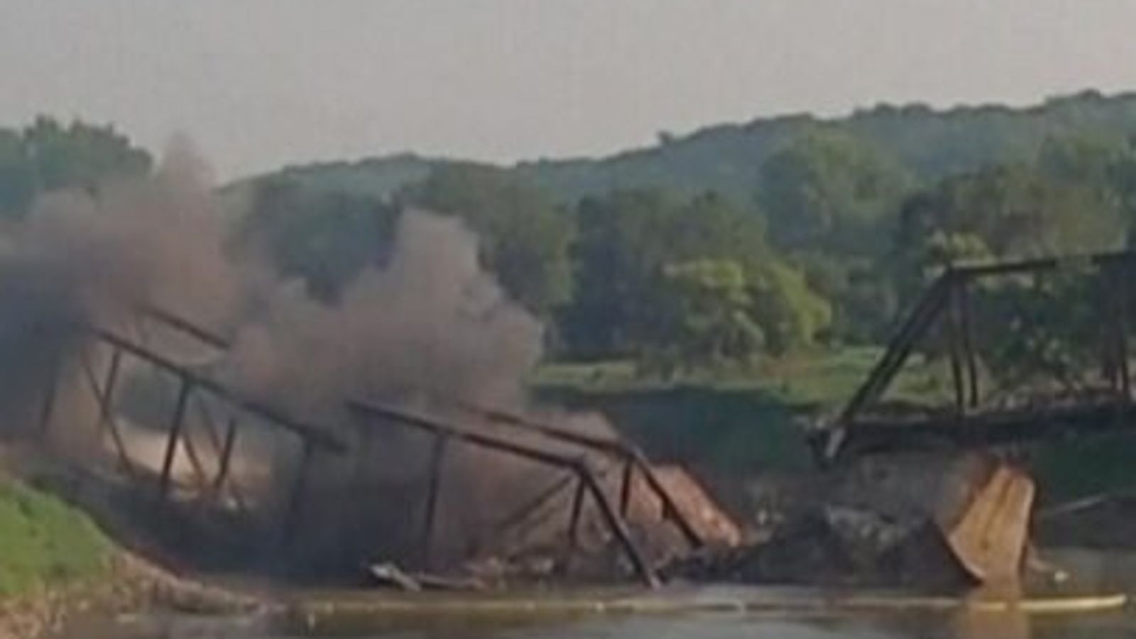 Collapsed bridge demolished in controlled explosion in Iowa | US News ...