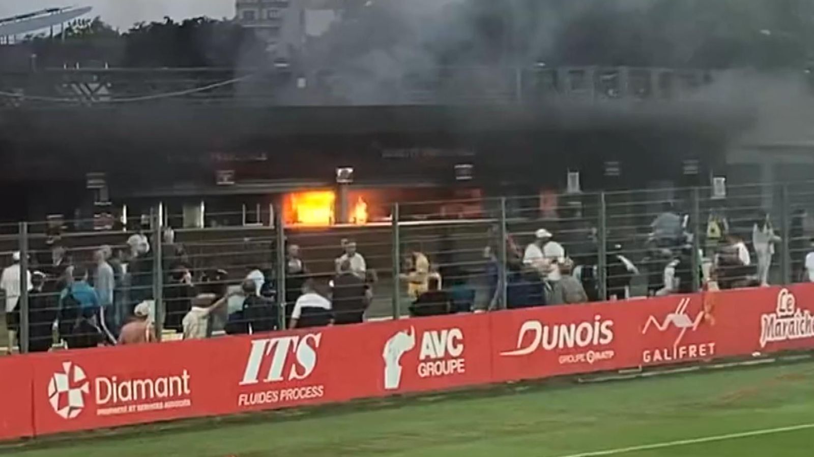 French stadium evacuated after fire breaks out during football match ...
