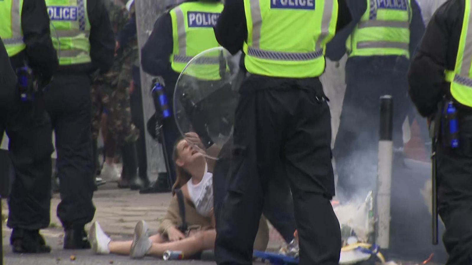Middlesbrough protests: Police drag woman away from burning rubbish bin ...