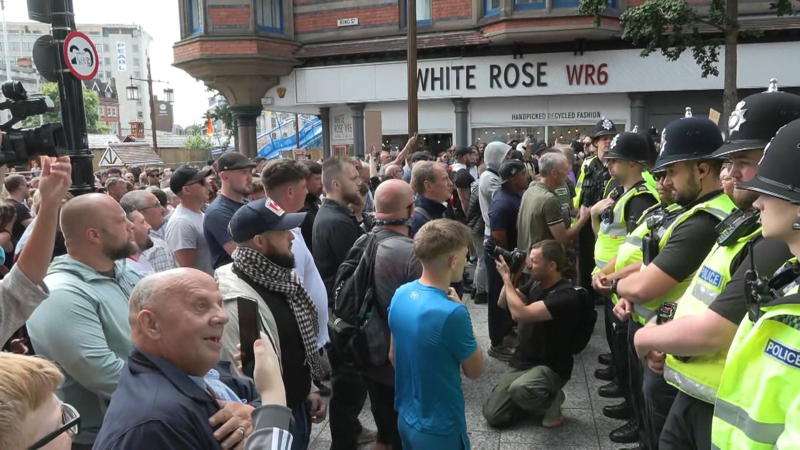 Protesters began to push police as officers separated them from anti ...