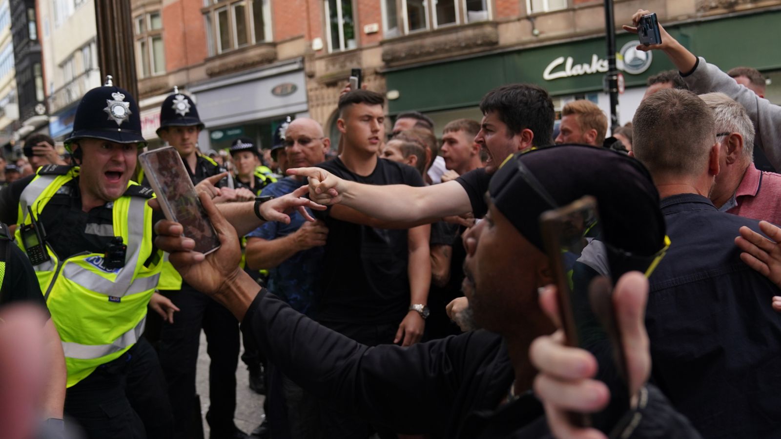 More than 90 arrested after officers injured in violent protests across ...