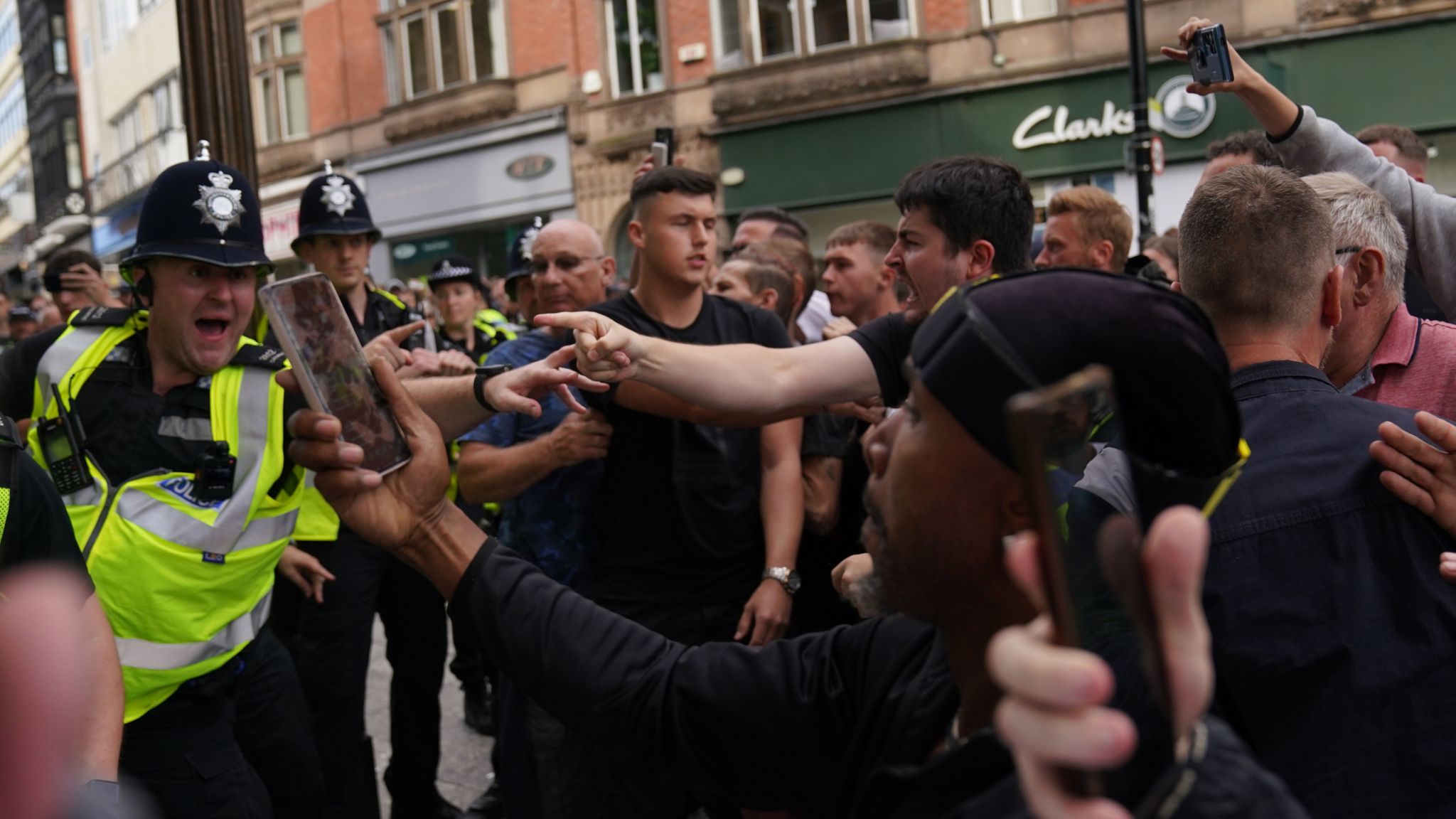 More than 90 arrested after officers injured in violent protests across ...