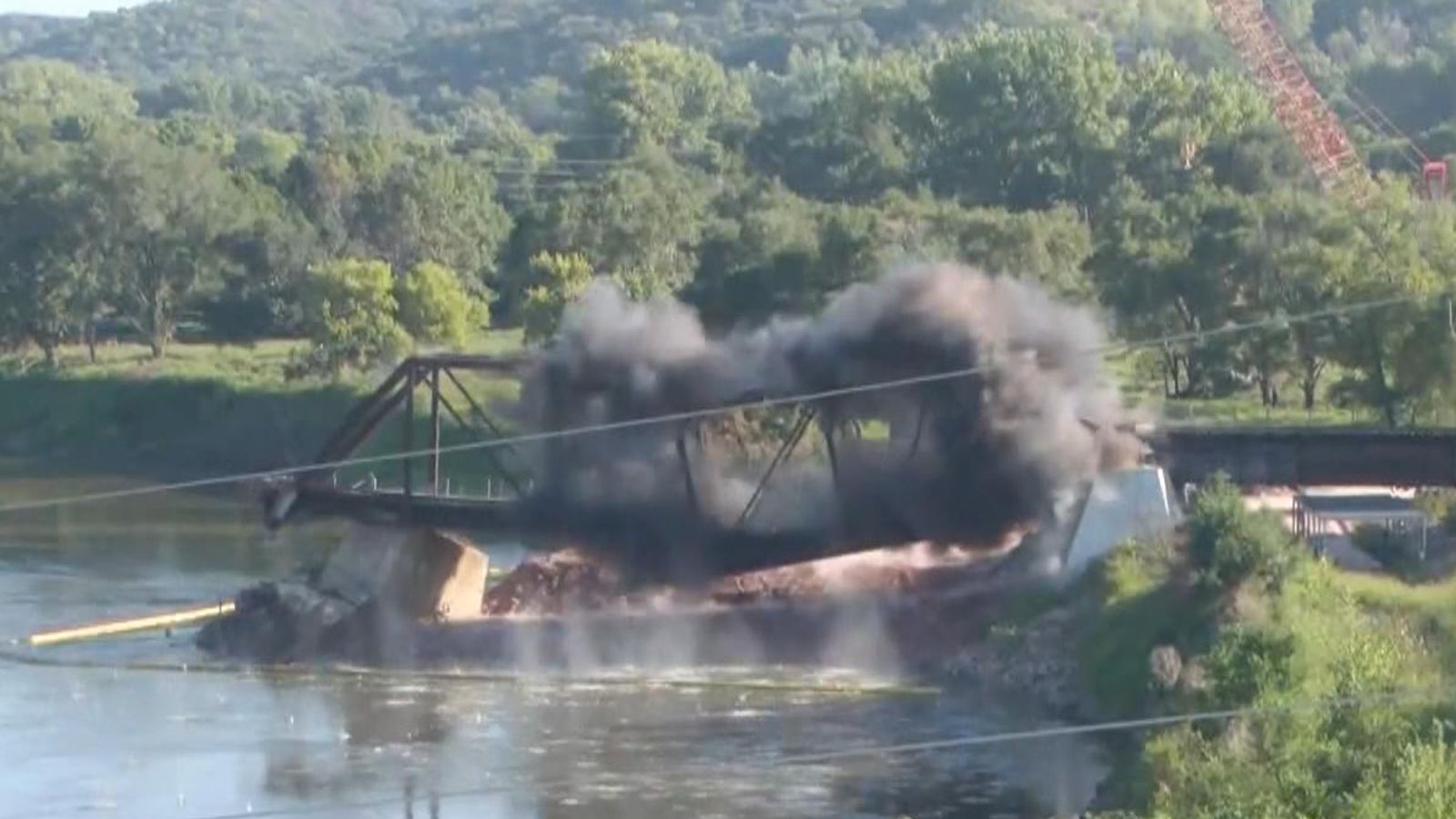Iowa: Watch as controlled explosion brings down collapsed train bridge ...