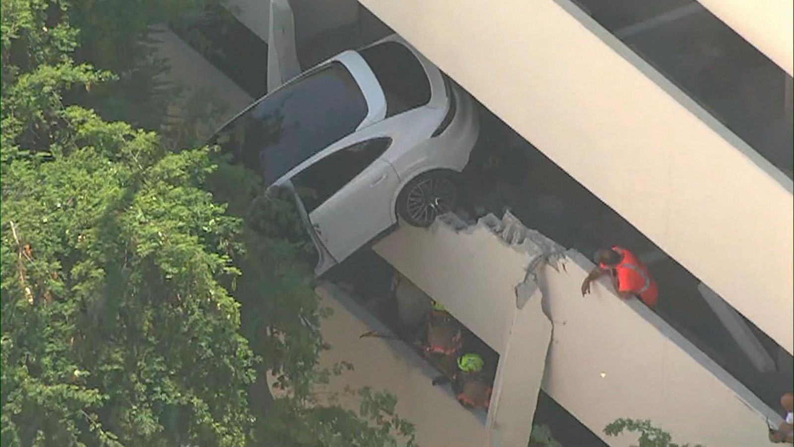 Woman saved after her car crashed through the barrier on the third ...