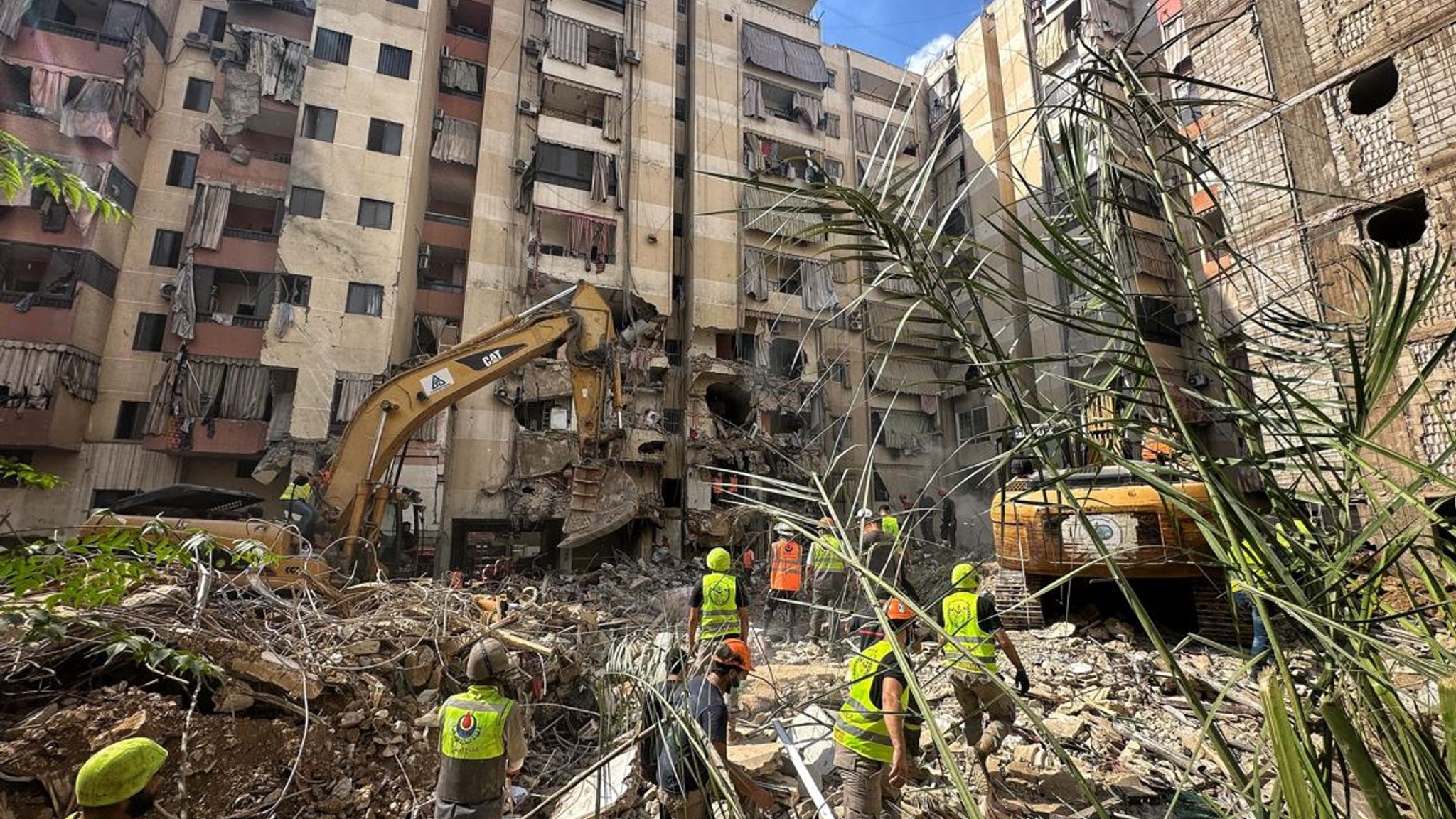 Anxious families line the pavement as dozens remain missing in the rubble days after Israel's ...