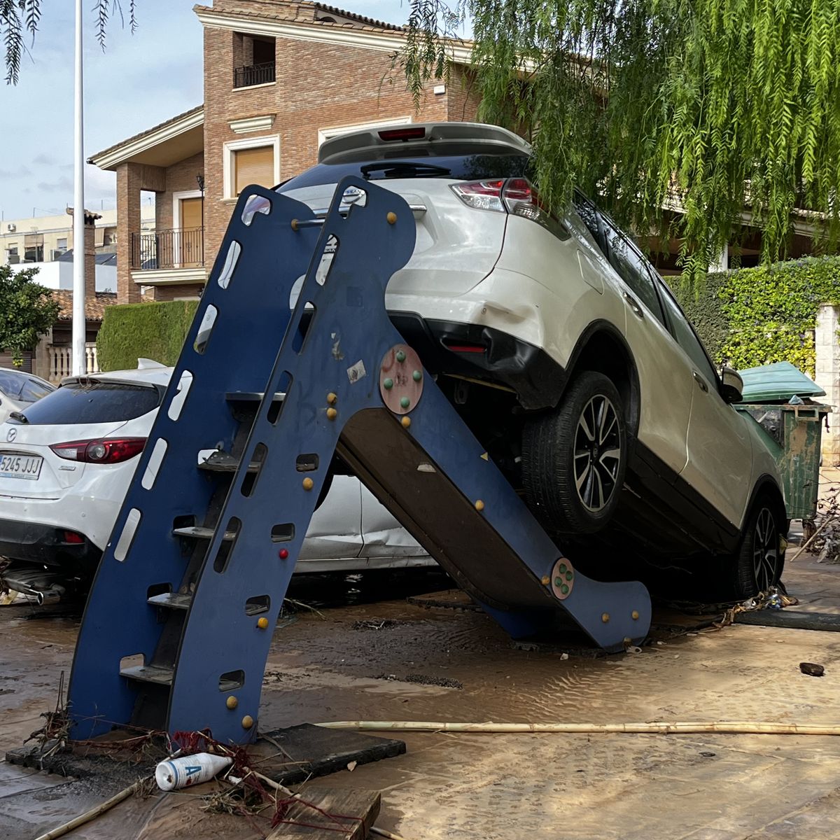 Spain floods: Utterly random damage in town where 40 died, with a car on top of children's slide ...