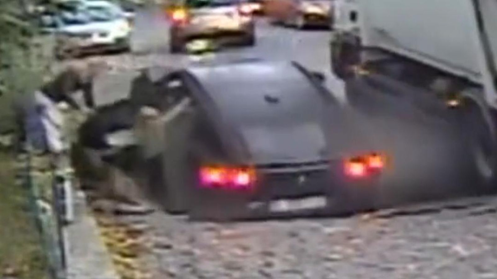 Moment road gives way causing child and car to fall into pit | World ...