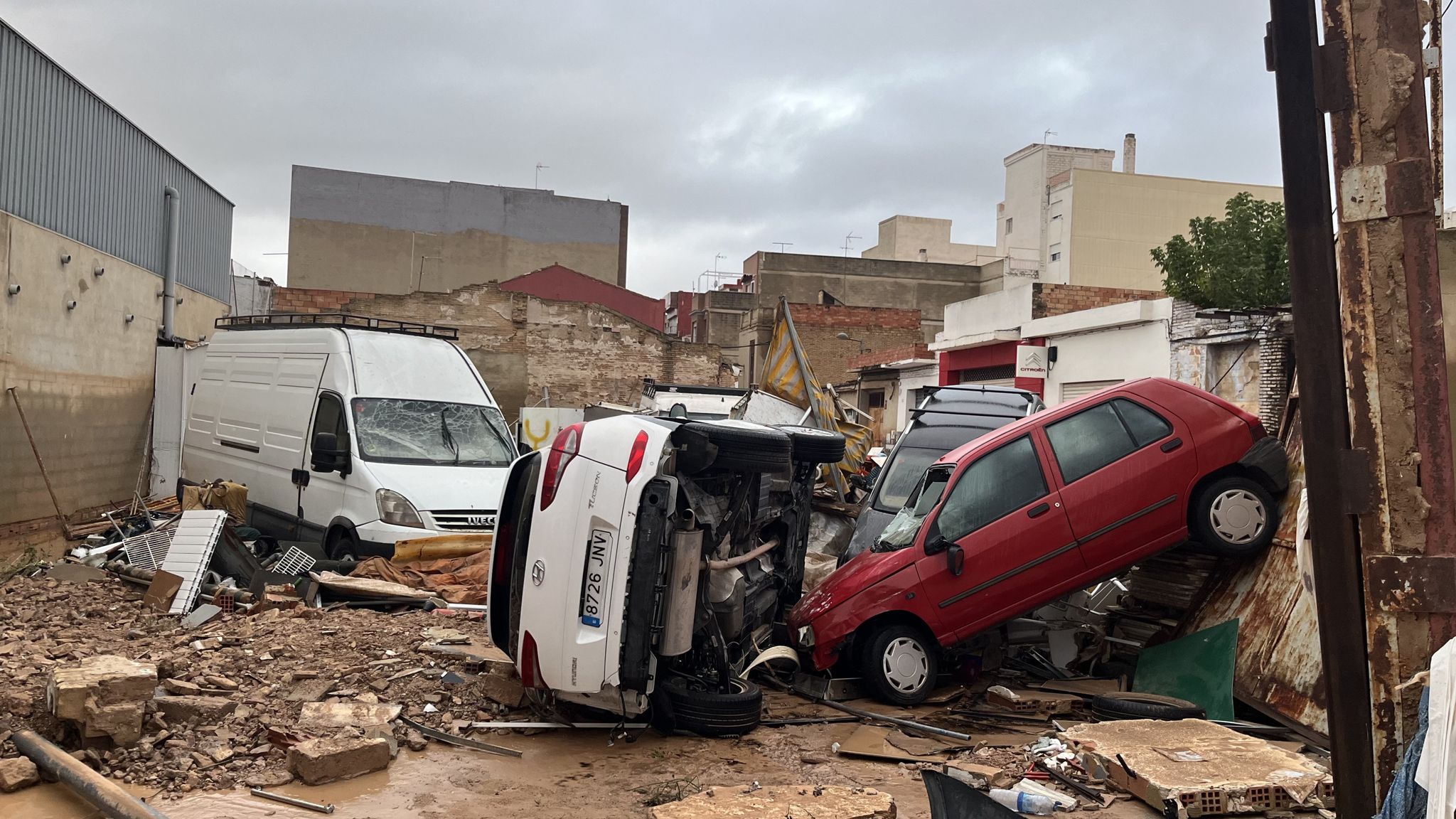 Spain floods: Utterly random damage in town where 40 died, with a car ...