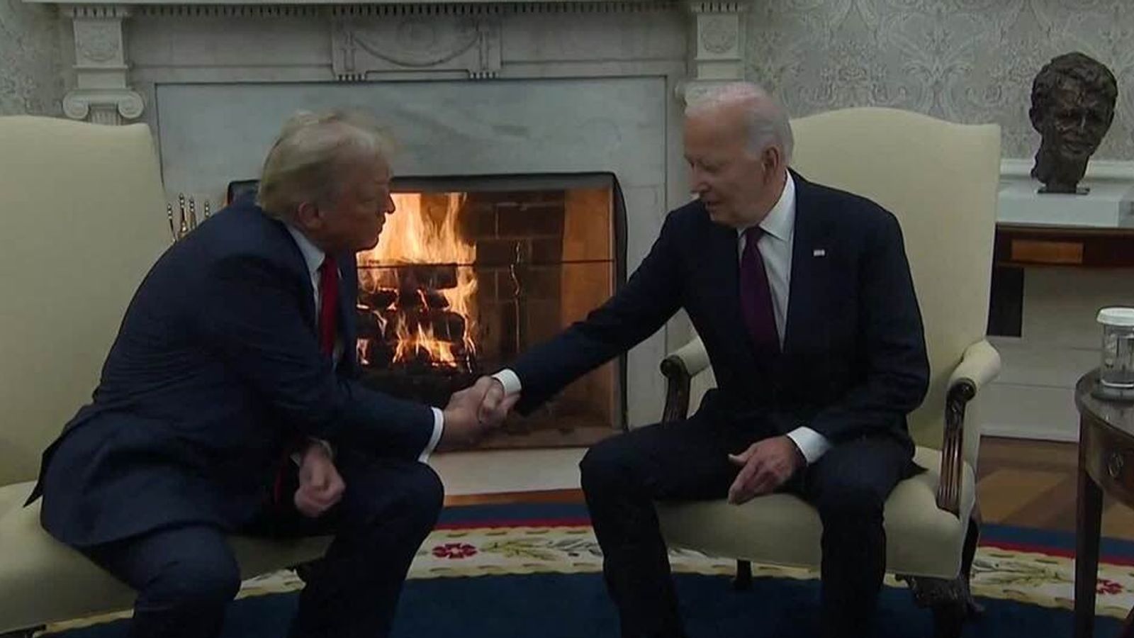 US President Joe Biden greets his successor Donald Trump with a ...