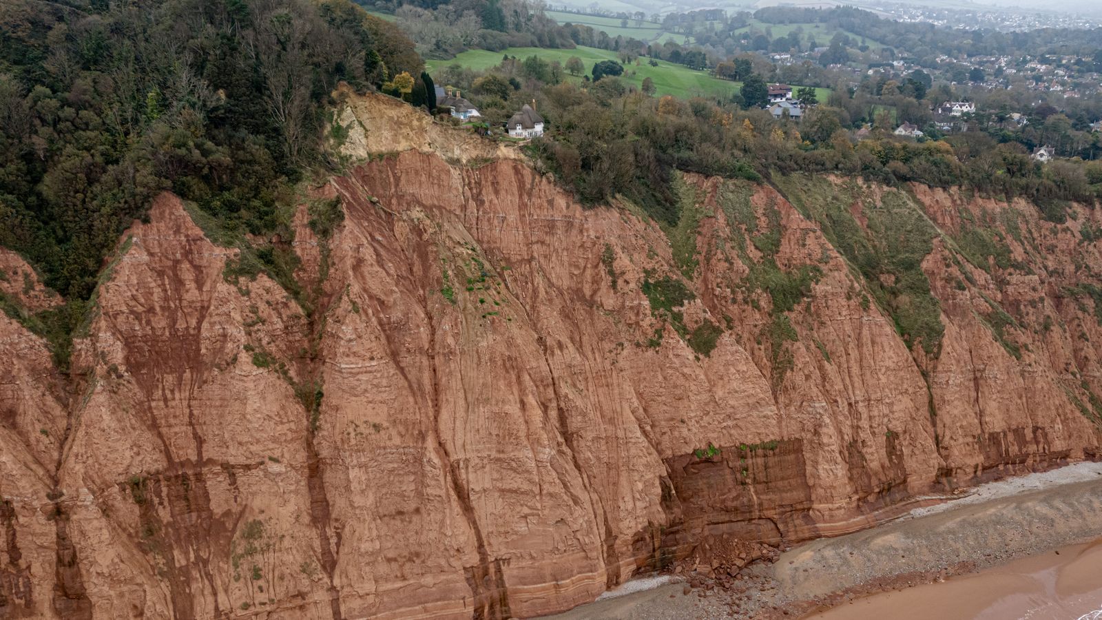 Cottage left teetering on cliff edge after massive Jurassic Coast ...