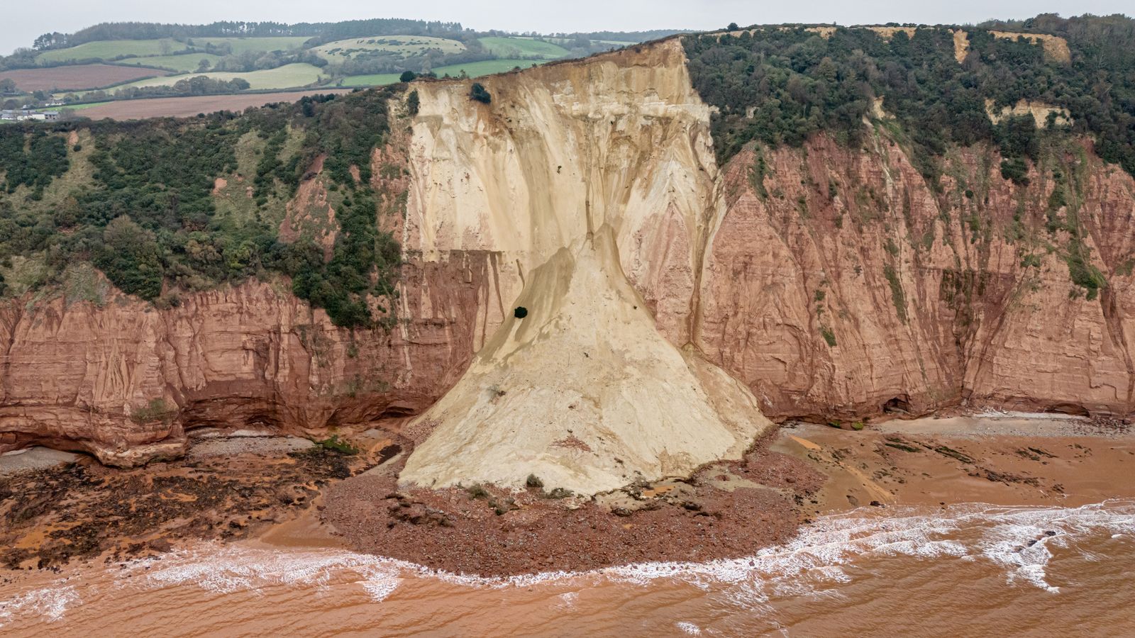 Cottage left teetering on cliff edge after massive Jurassic Coast ...
