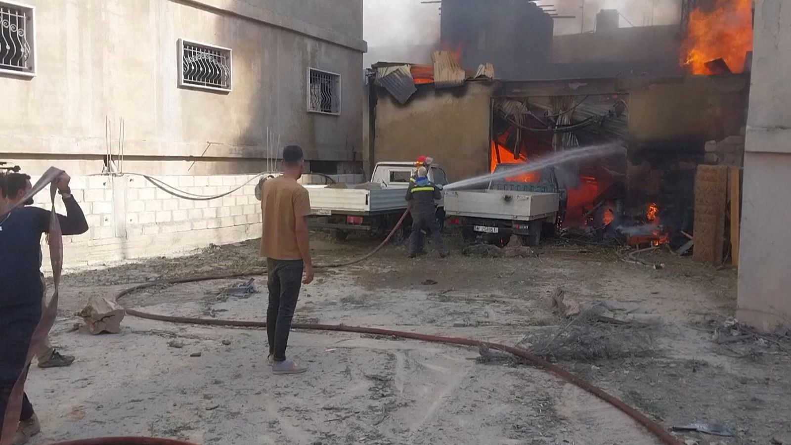 Firefighters putting out fires after Israel’s deadly strikes | World ...