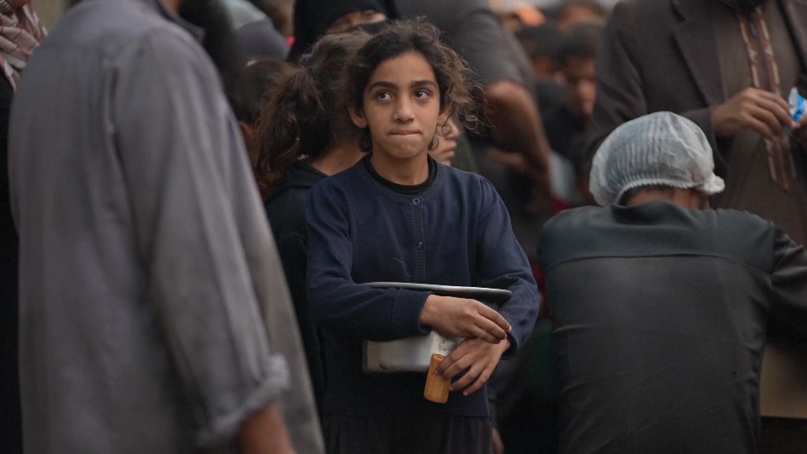 Gaza Strip: Palestinian children queue up for food | World News | Sky News