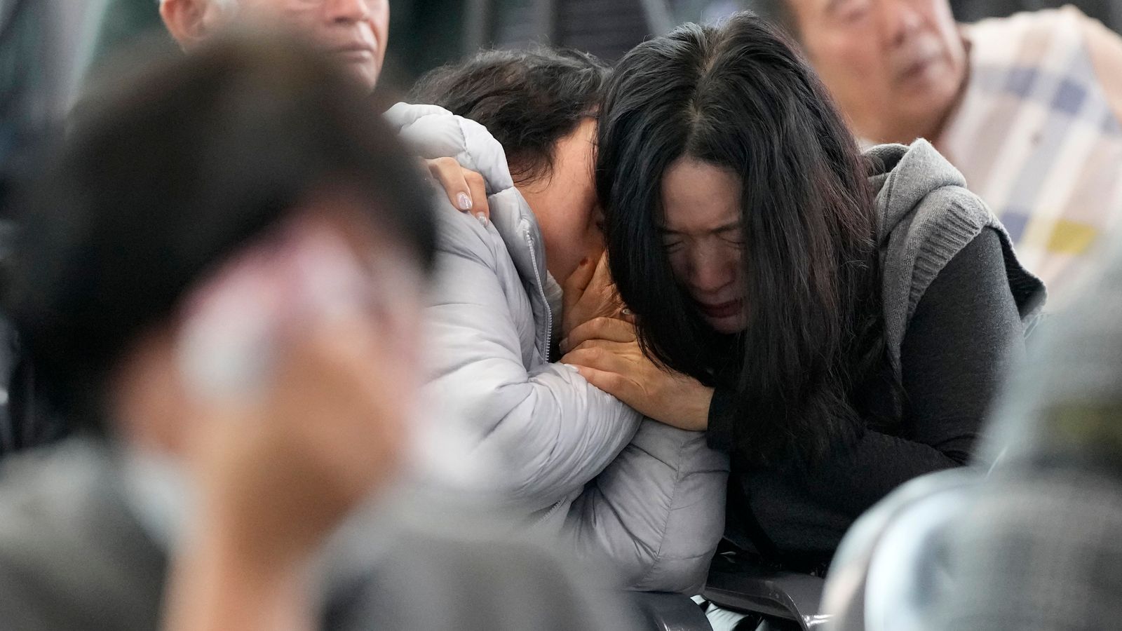 Stillness and shock after South Korea's plane tragedy - but families ...