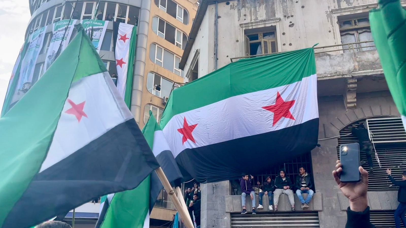 Syrians celebrate 'Victory Day' - but are nervous about what comes next ...