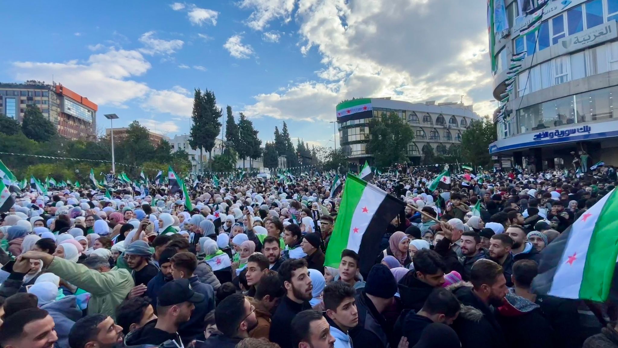 Syrians celebrate 'Victory Day' - but are nervous about what comes next ...