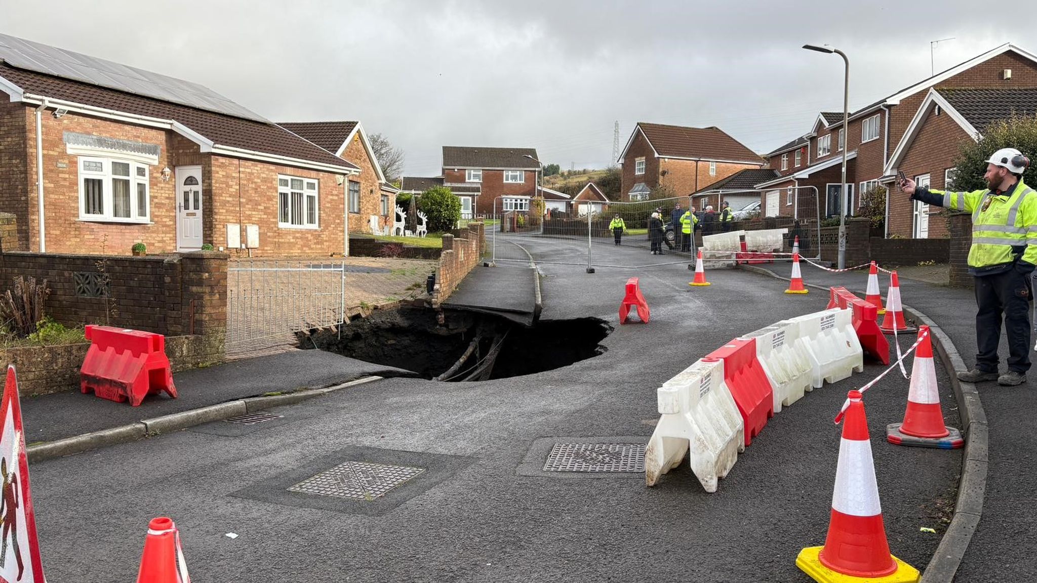 Large sinkhole opens up in South Wales as residents told to stay away ...