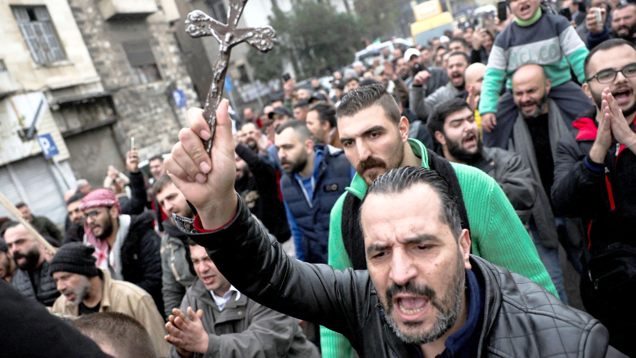 Hundreds protest in Damascus after Syrian Christmas tree set on fire ...