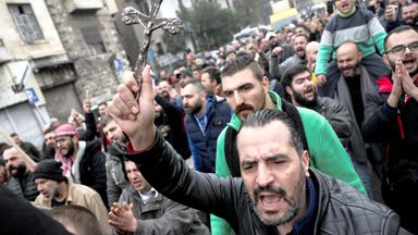 Hundreds protest in Damascus after Syrian Christmas tree set on fire ...