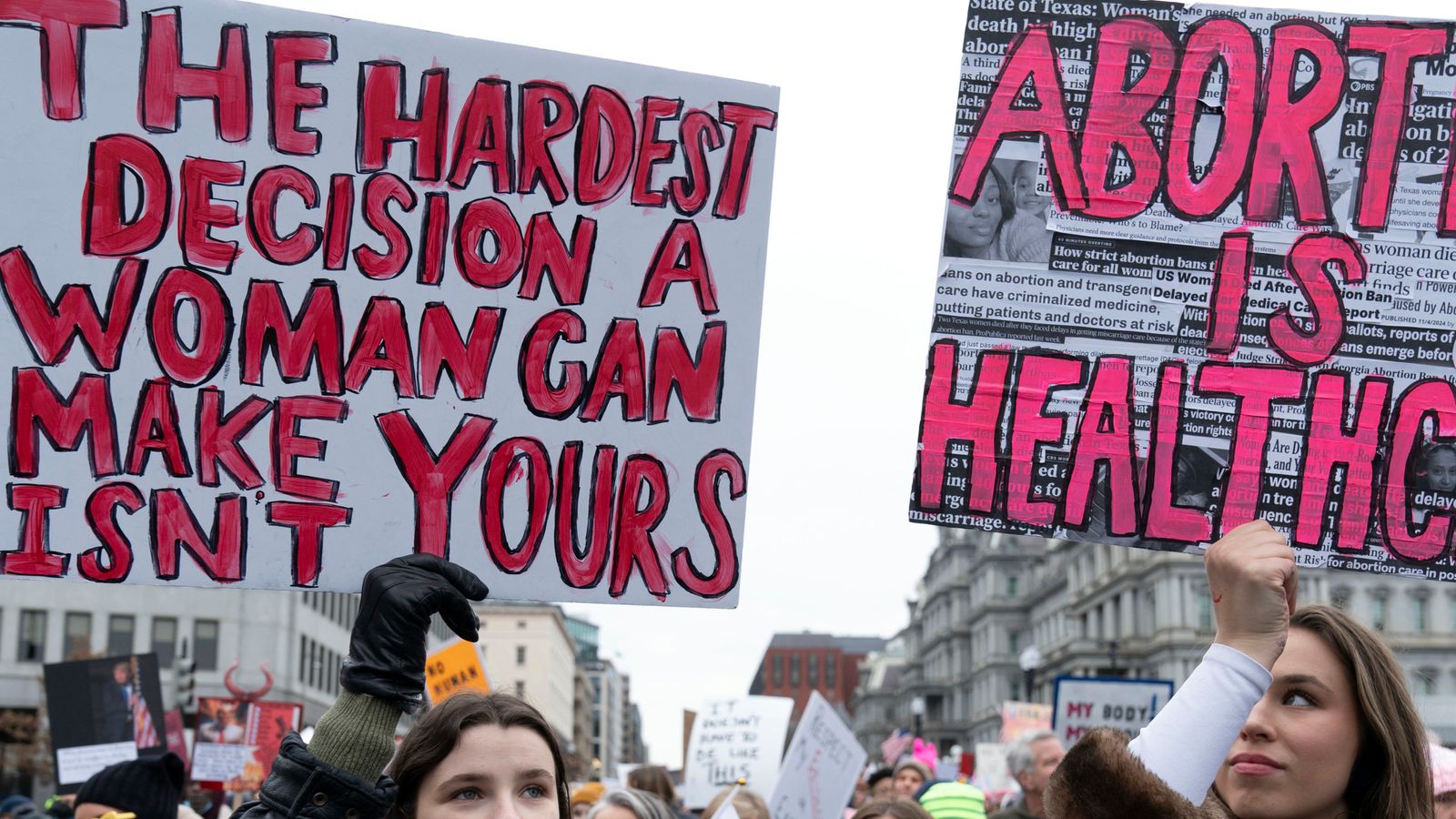 Thousands march in Washington DC as Trump heads back to capital for ...