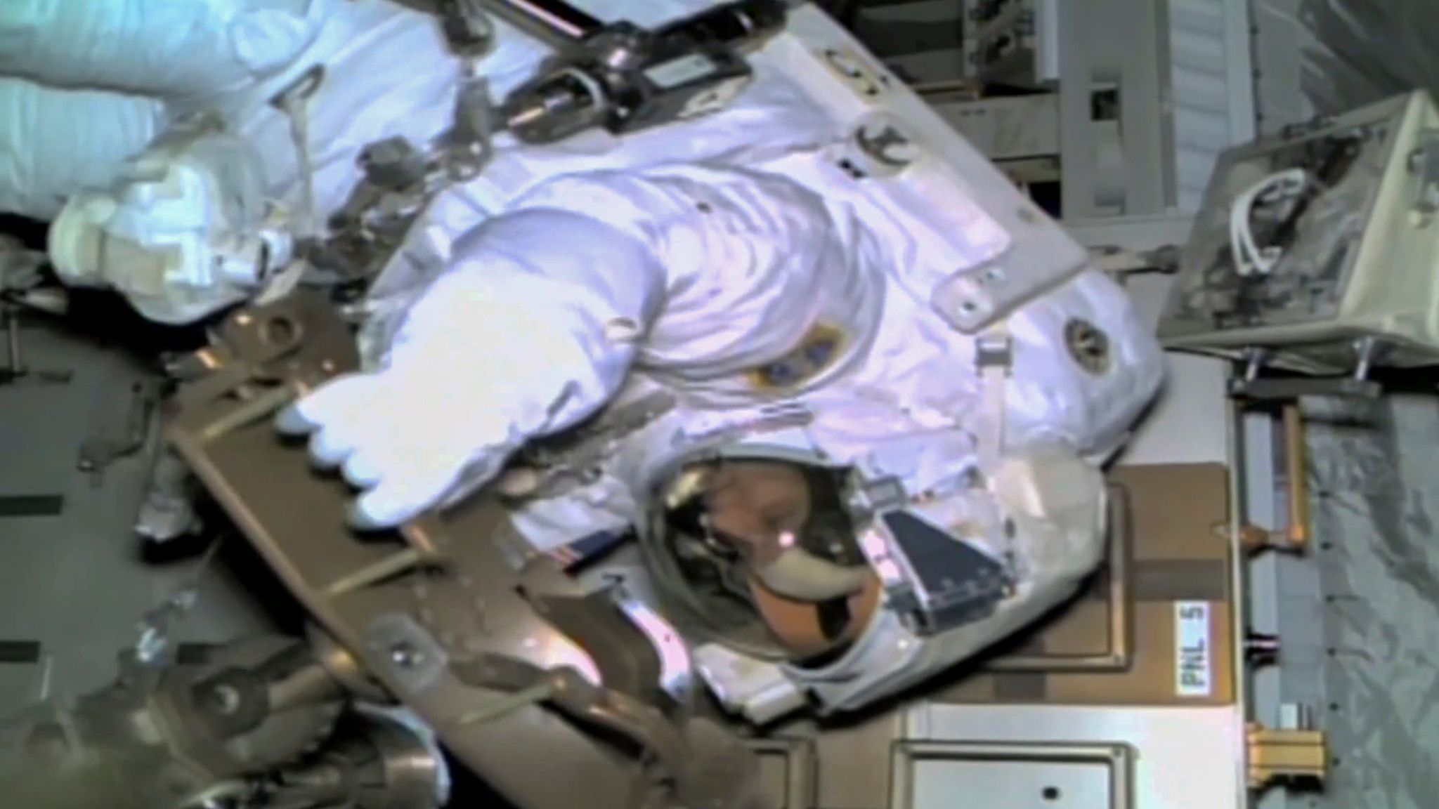 NASA's stuck astronaut steps out for a spacewalk after seven months in ...