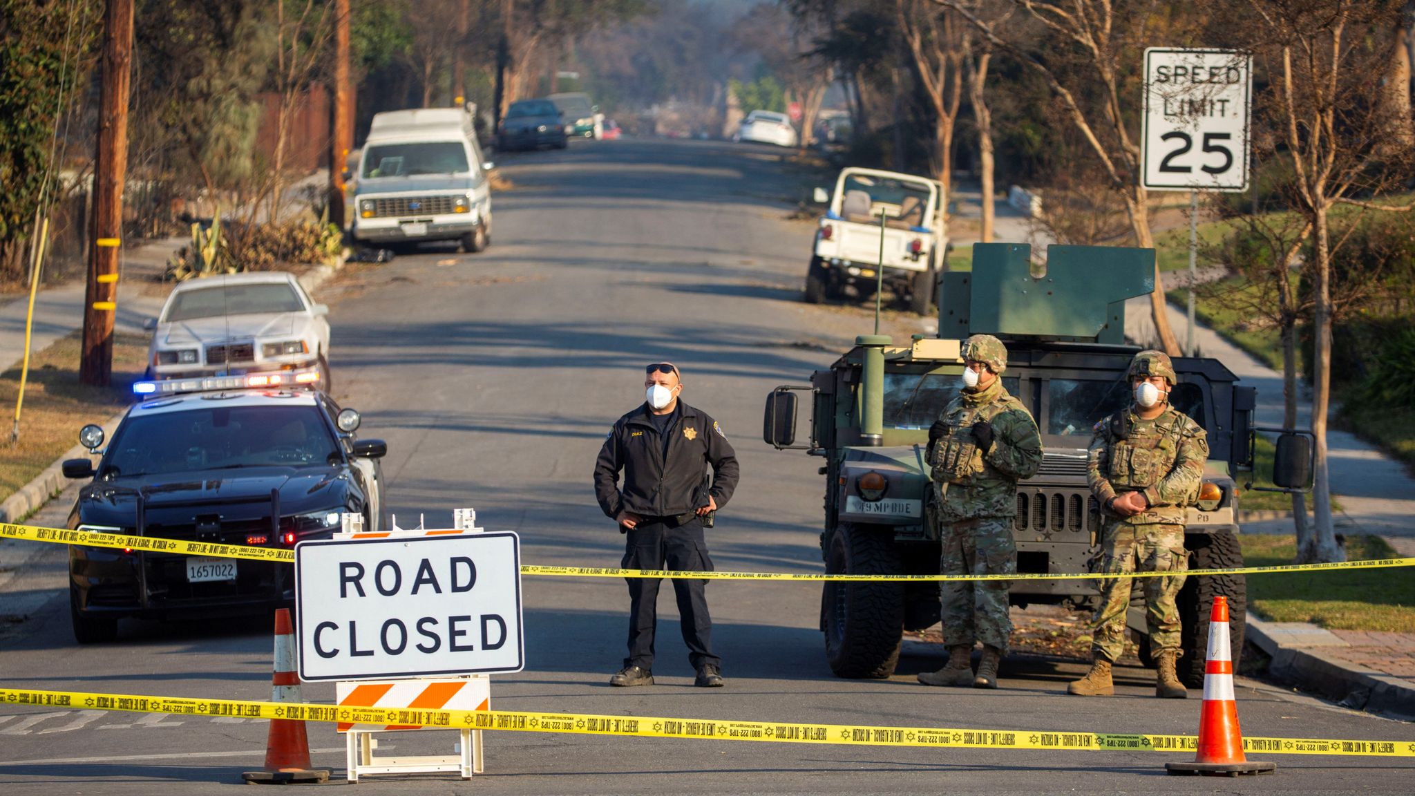 Crackdown on looting in burnt-out areas as fires continue to burn in LA ...